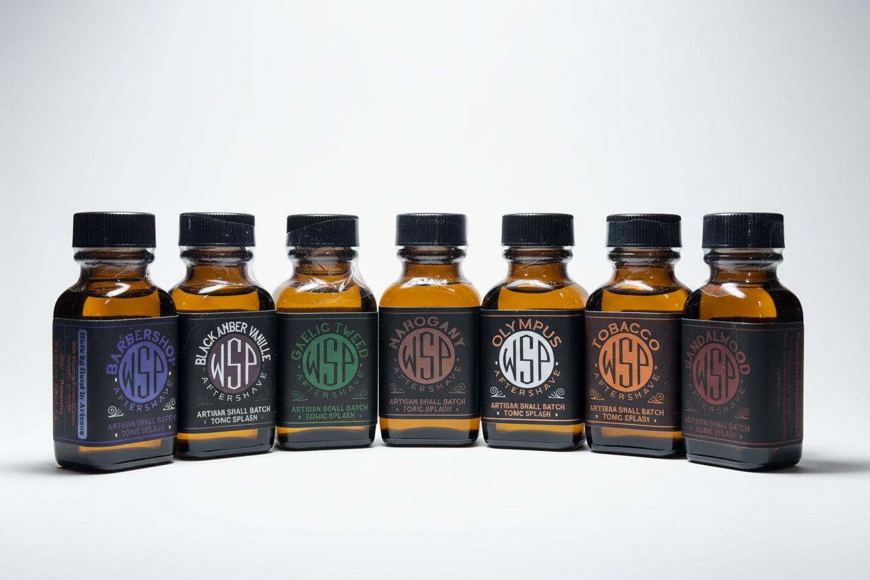 Row of small bottles with labels on a white background